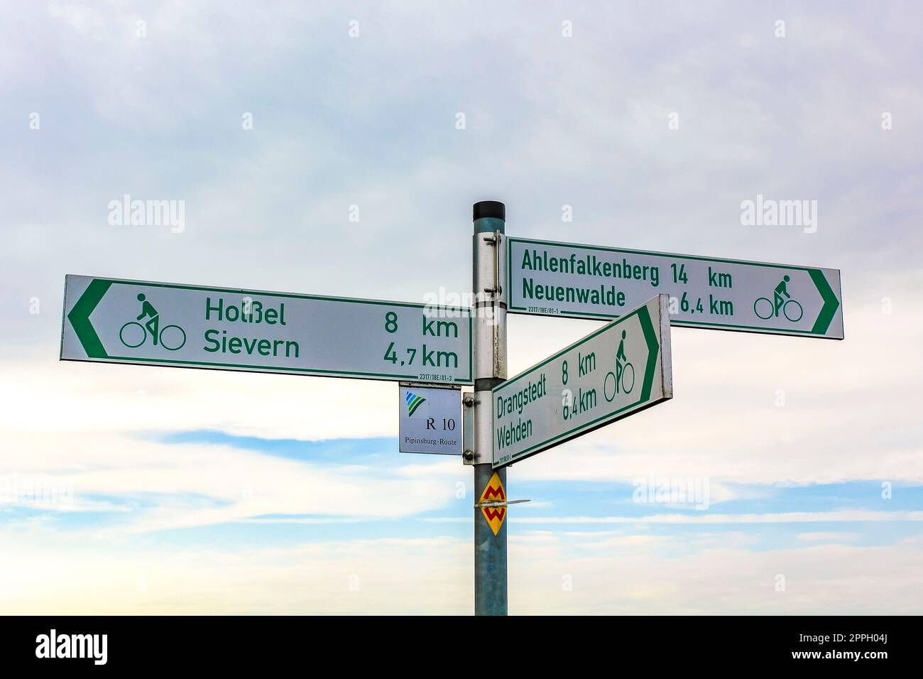 Green and white hiking and directional signs in Germany Stock Photo - Alamy
