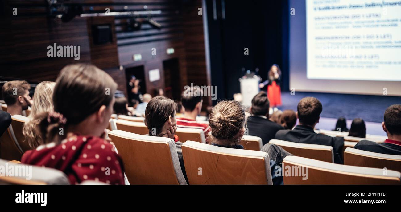 Woman giving presentation on business conference event Stock Photo - Alamy