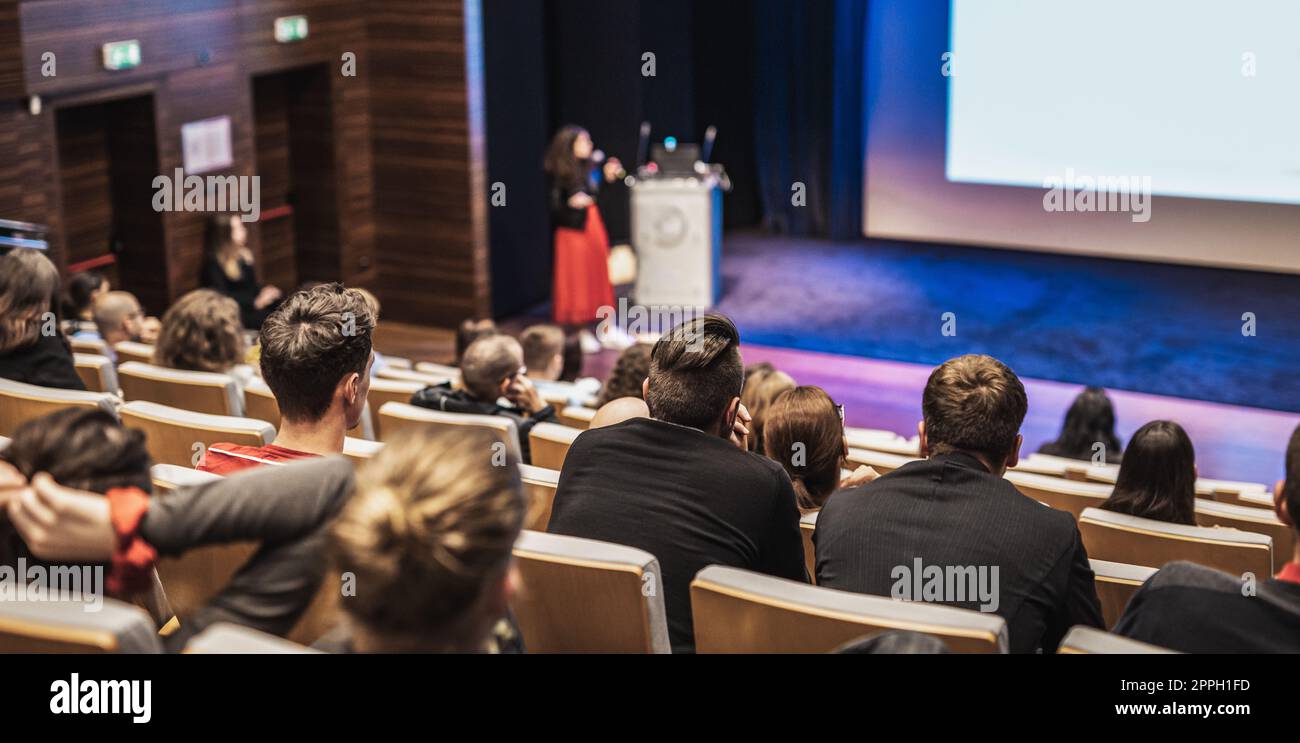 Woman giving presentation on business conference event Stock Photo - Alamy