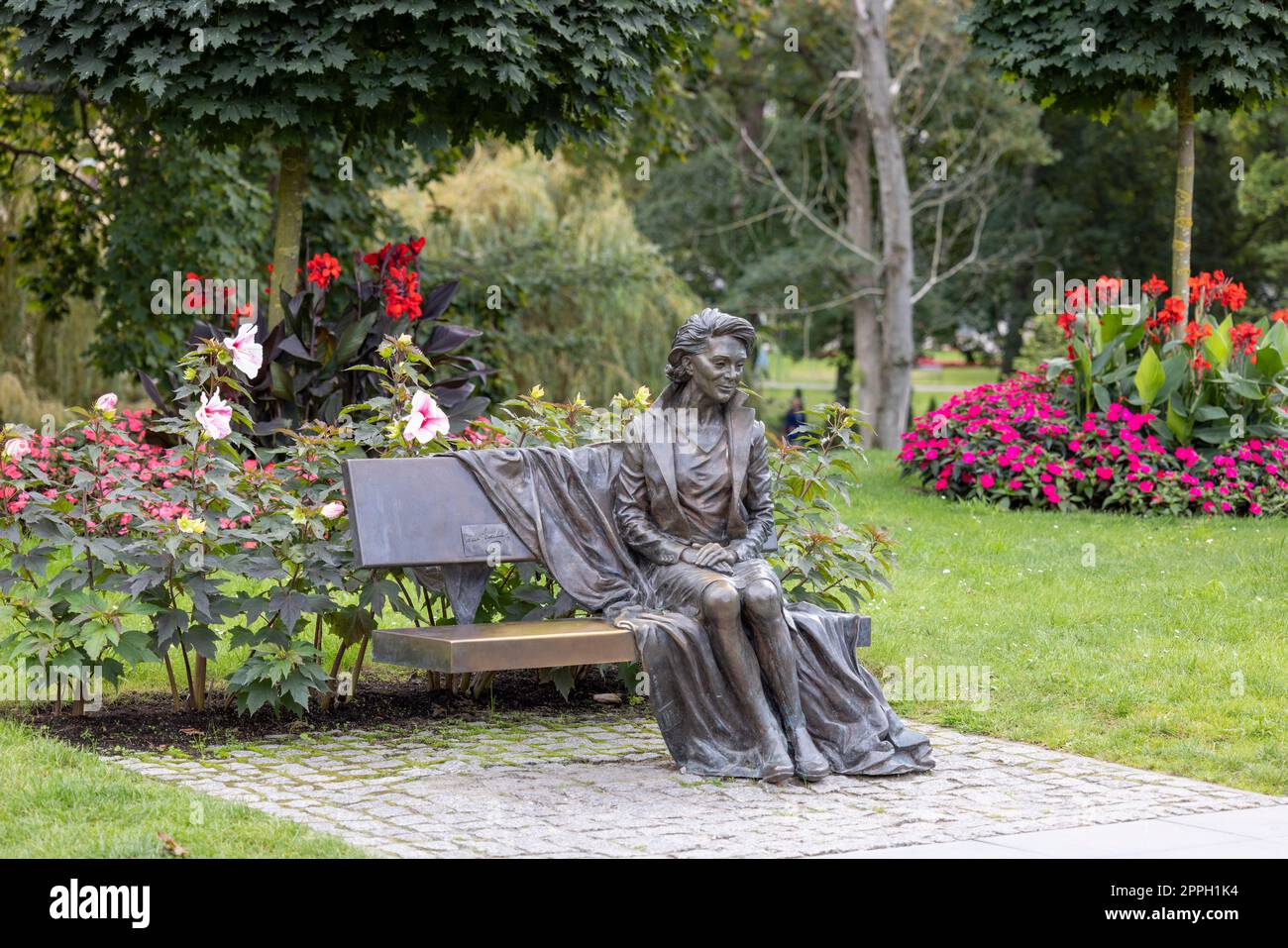 Monument of Polish singer Irena Jarocka sitting on a bench in a park ...
