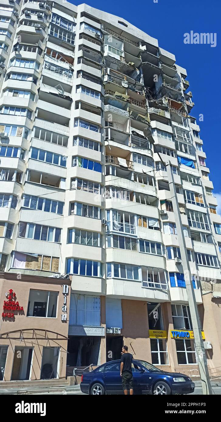 Destruction in wall of multi-storey building after being hit by ...