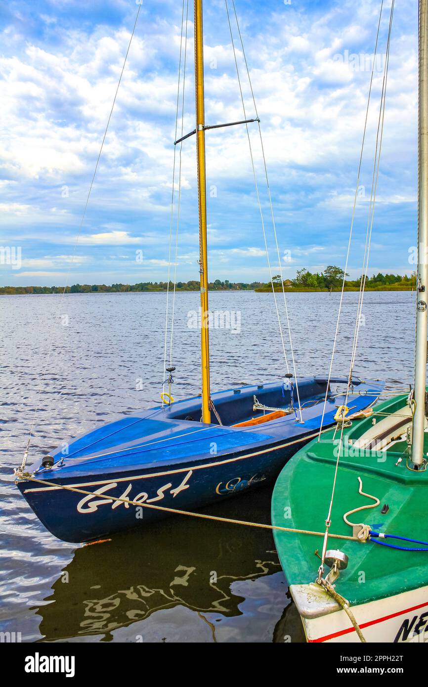 Old beautiful boats and sailboats on the jetty in Germany Stock Photo ...