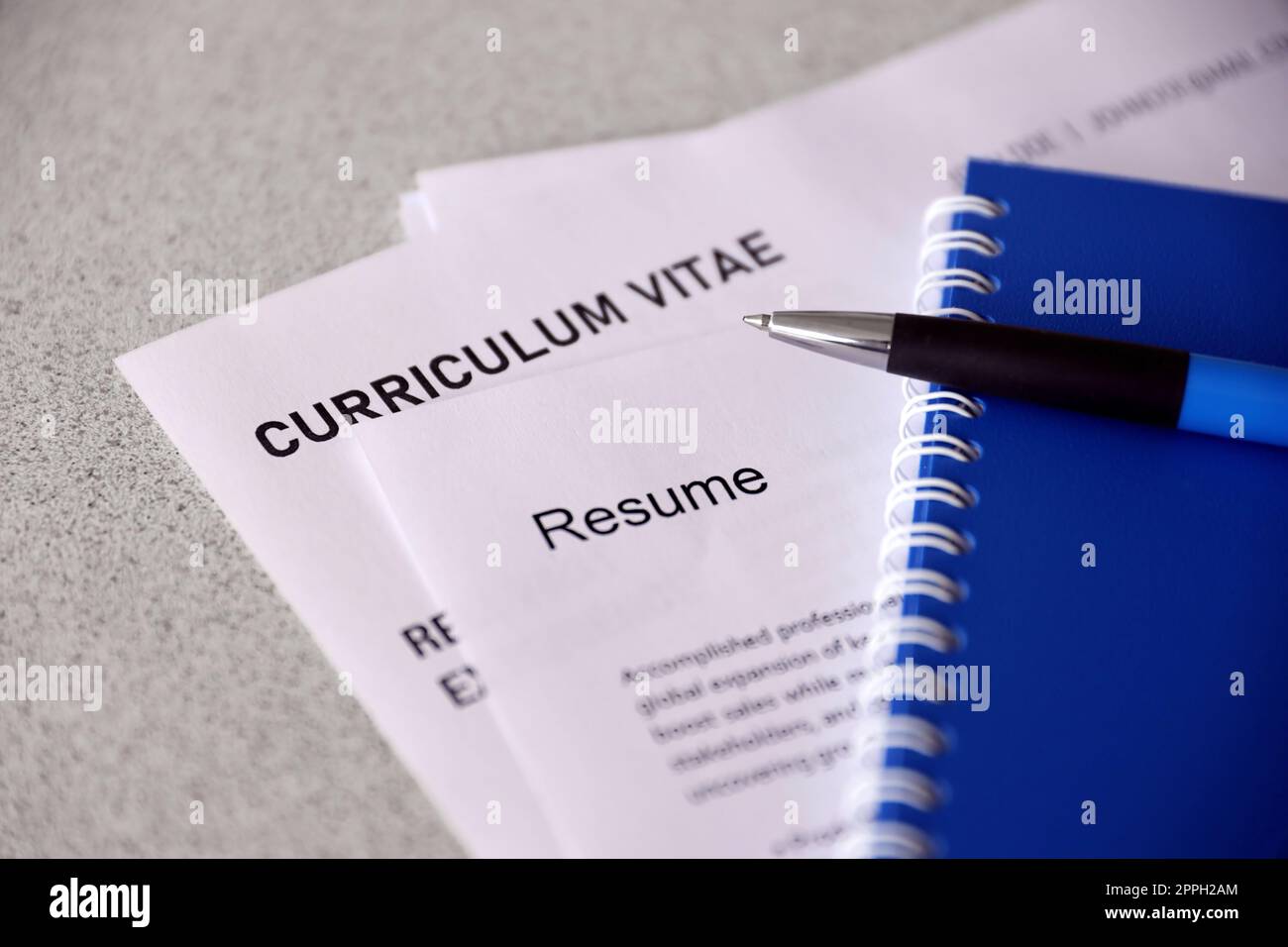 Top view of stack of office documents including resume and cv forms on ...