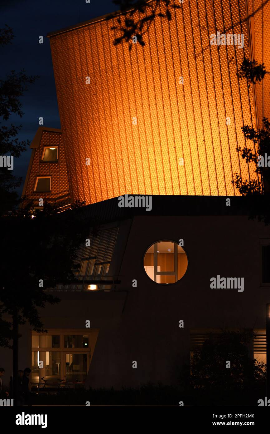 Golden building of the Berlin Philharmonic Hall at night Stock Photo ...