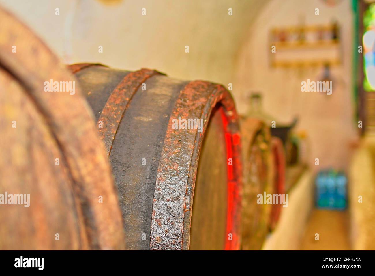 Wine cellar with wooden barrels. Wines fermented in classic wooden ...