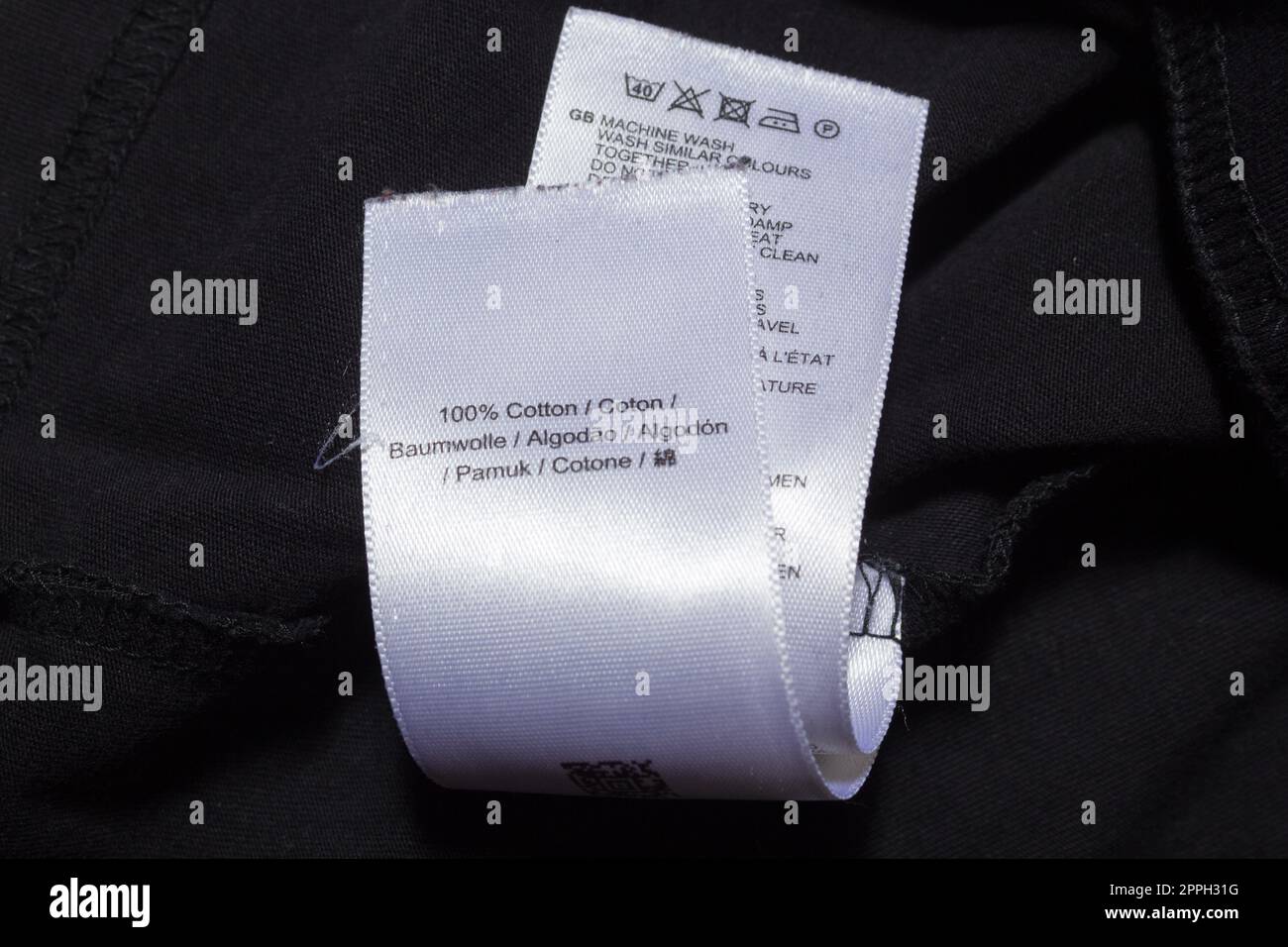 100 cotton tag in various languages Stock Photo - Alamy