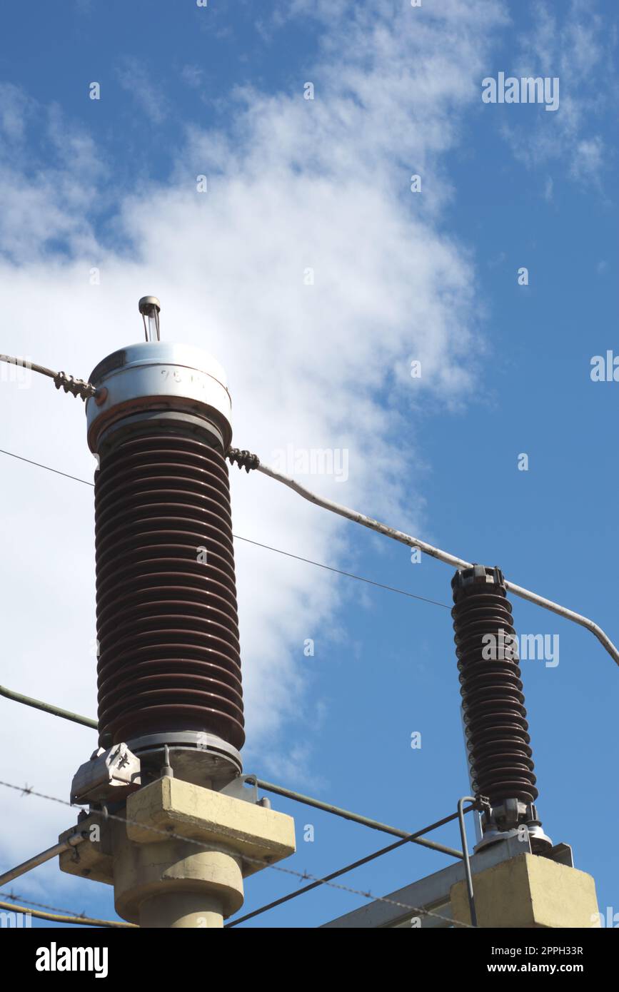 Ceramic insulators on a high voltage power line. Detail close up Stock ...