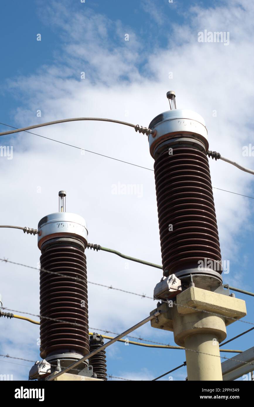 Ceramic insulators on a high voltage power line. Detail close up Stock ...