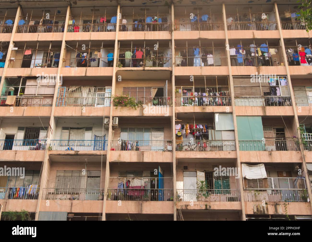 Balconies on a decaying and overcrowded apartment building in Saigon ...