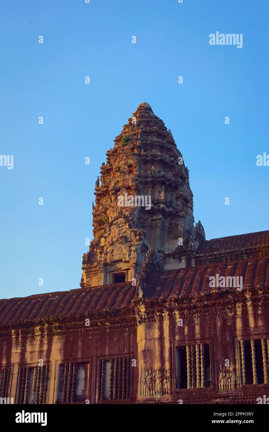 Angkor Wat, in Cambodia. Low angle view of one of the central towers at ...