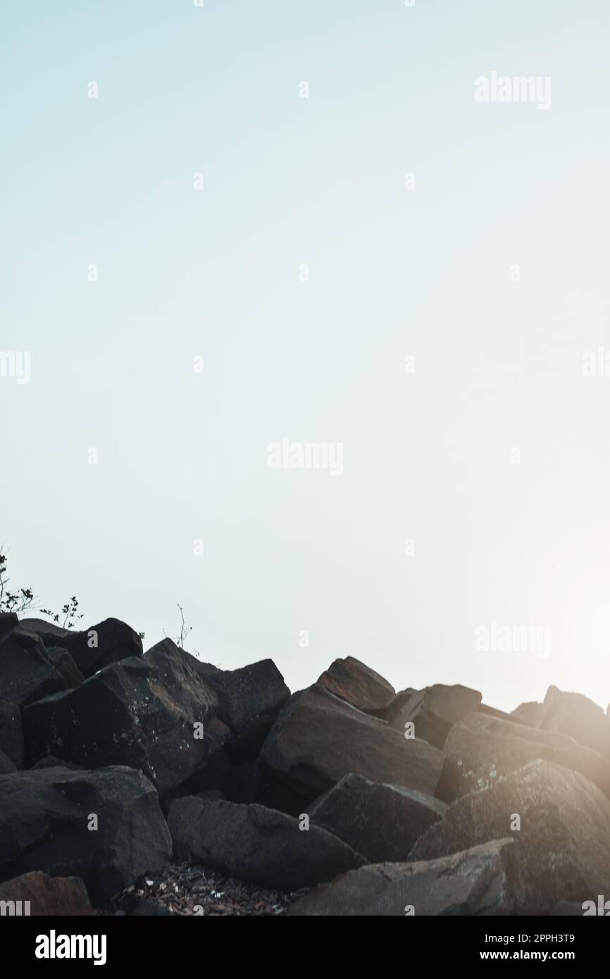 Nature has many forms. a group of sharp rocks next to each with the sun ...