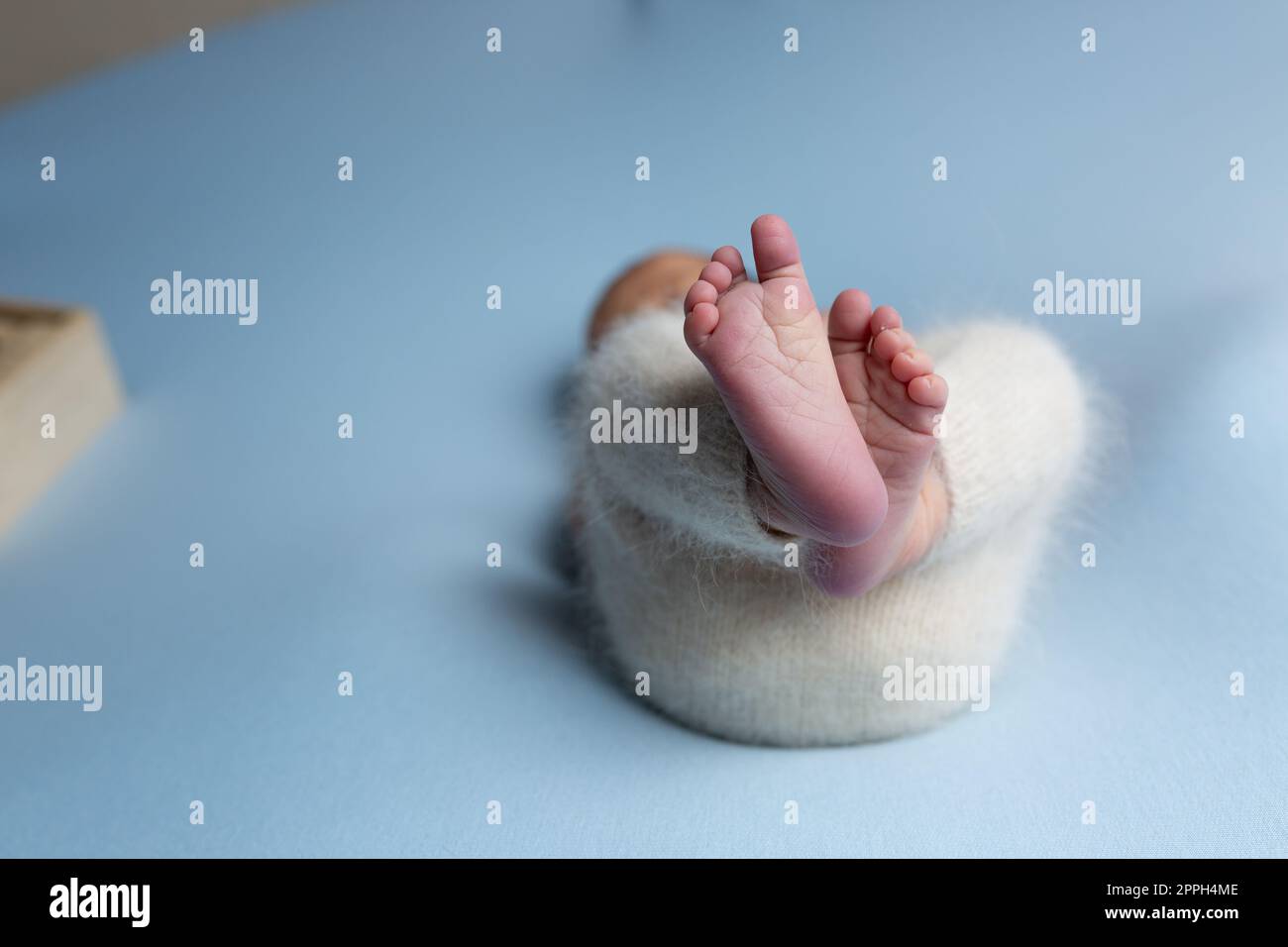 twisted child. Soft feet of a newborn Stock Photo - Alamy