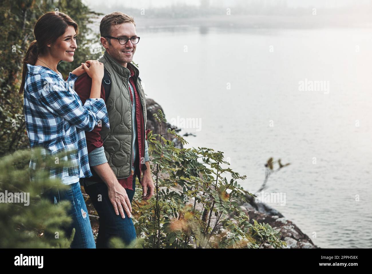 We make time to explore the unseen. a young couple exploring nature ...