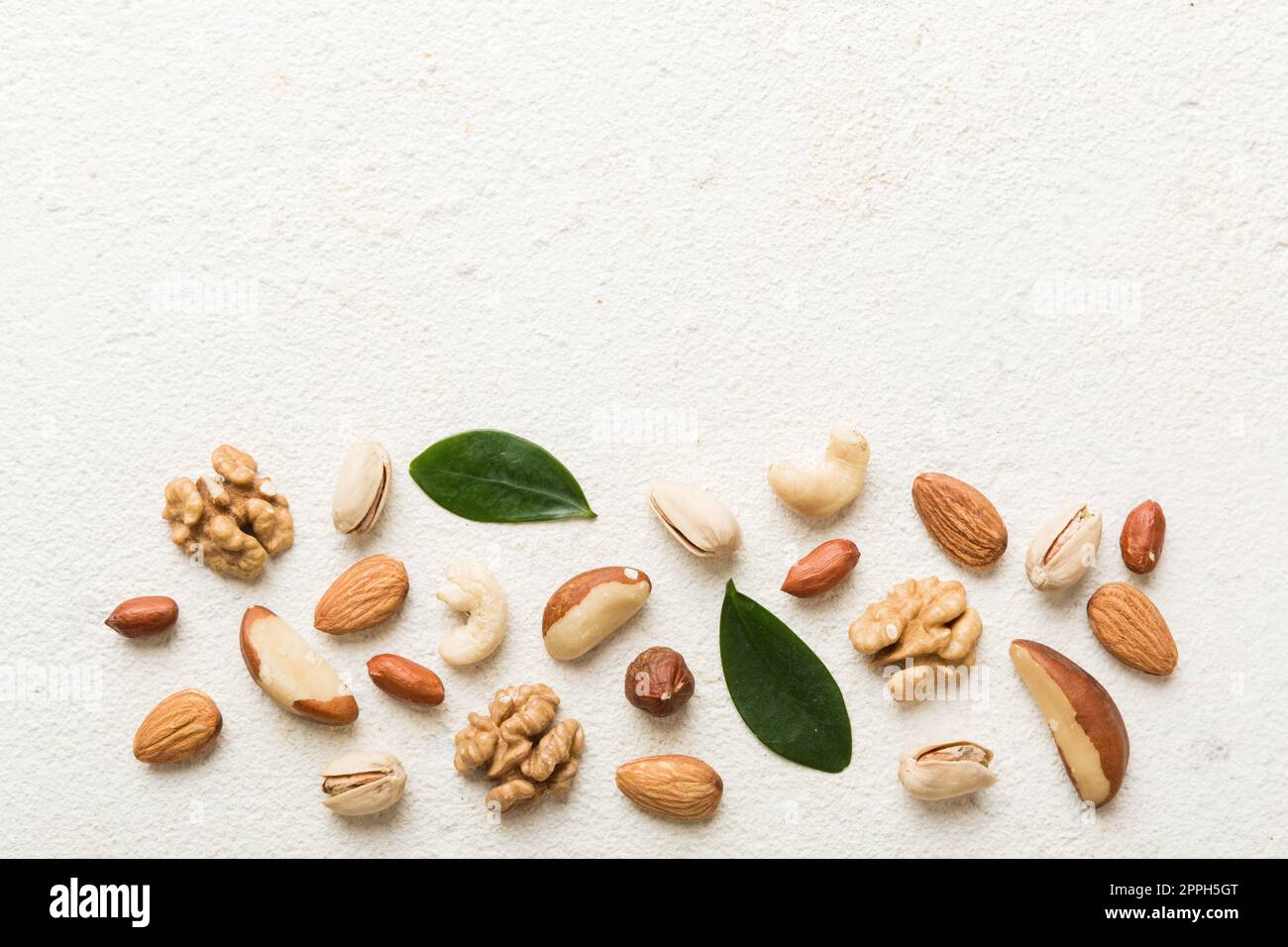 Composition of nuts , flat lay - mix hazelnuts, cashews, almonds on ...