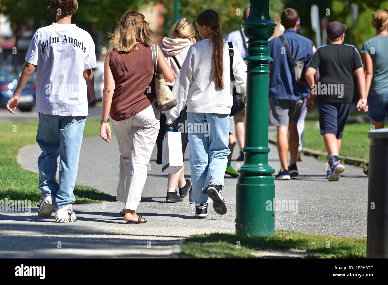 Street scene with many people from behind Stock Photo - Alamy