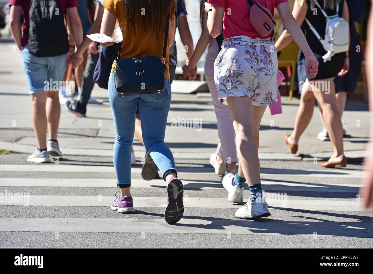 Street scene with many people from behind Stock Photo - Alamy