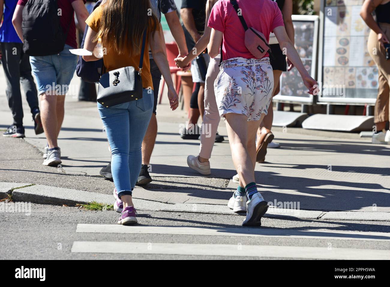 Street scene with many people from behind Stock Photo - Alamy