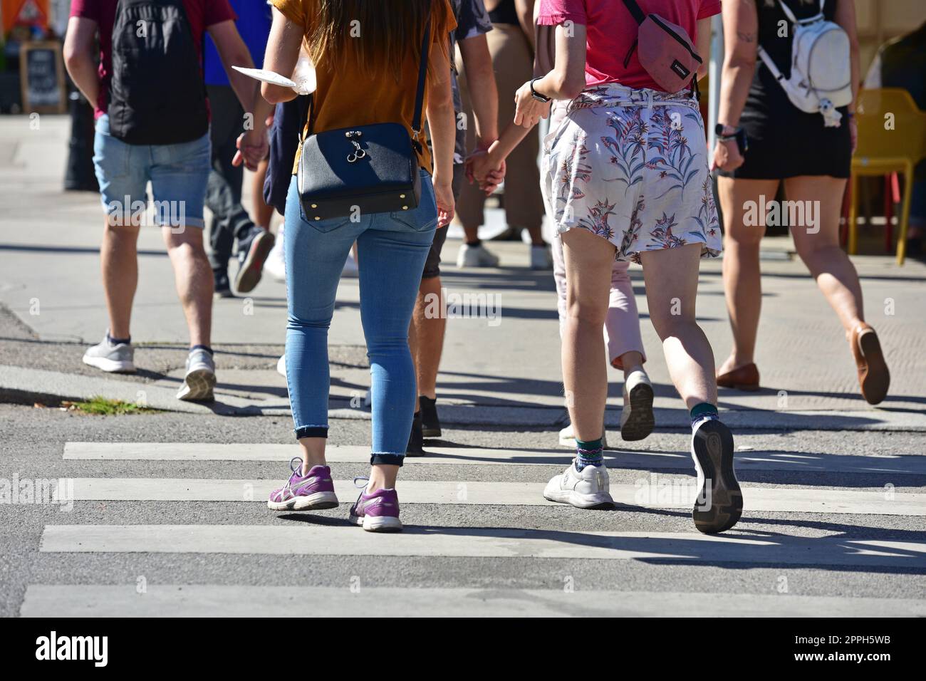 Street scene with many people from behind Stock Photo - Alamy