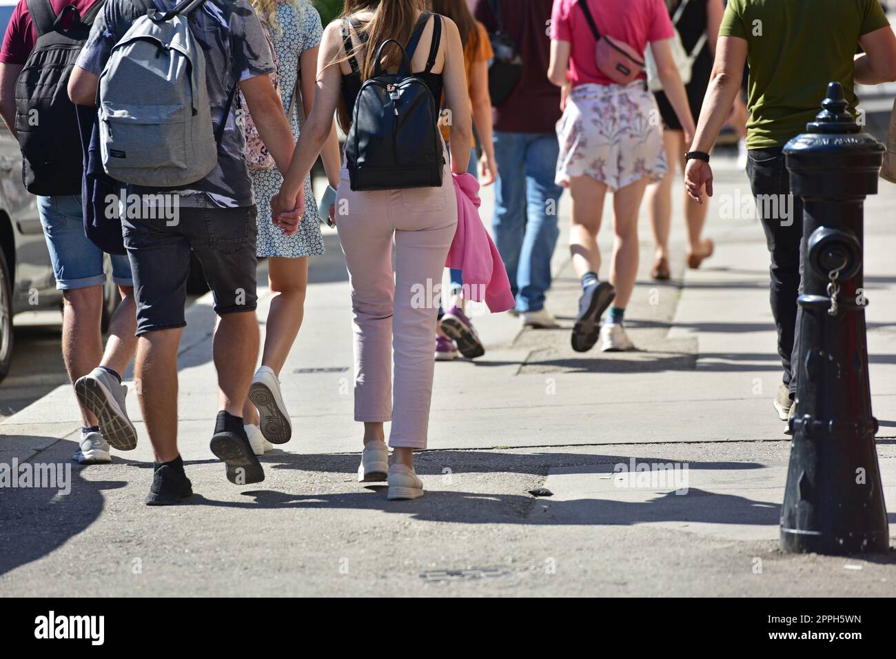 Street scene with many people from behind Stock Photo - Alamy