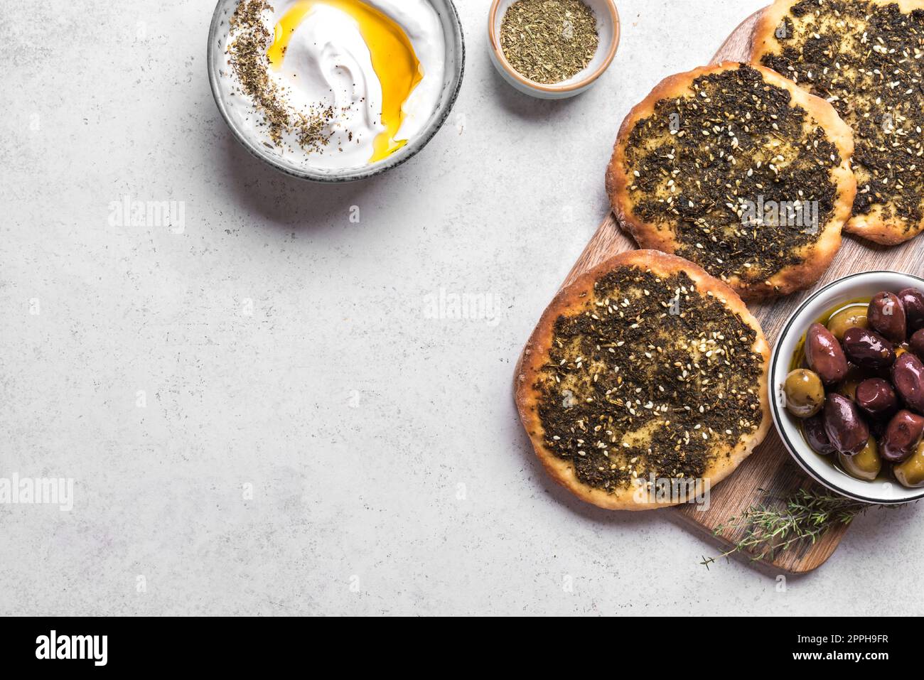 Manakeesh, arabic pizza, flat bread topped with zaatar spices, copy ...