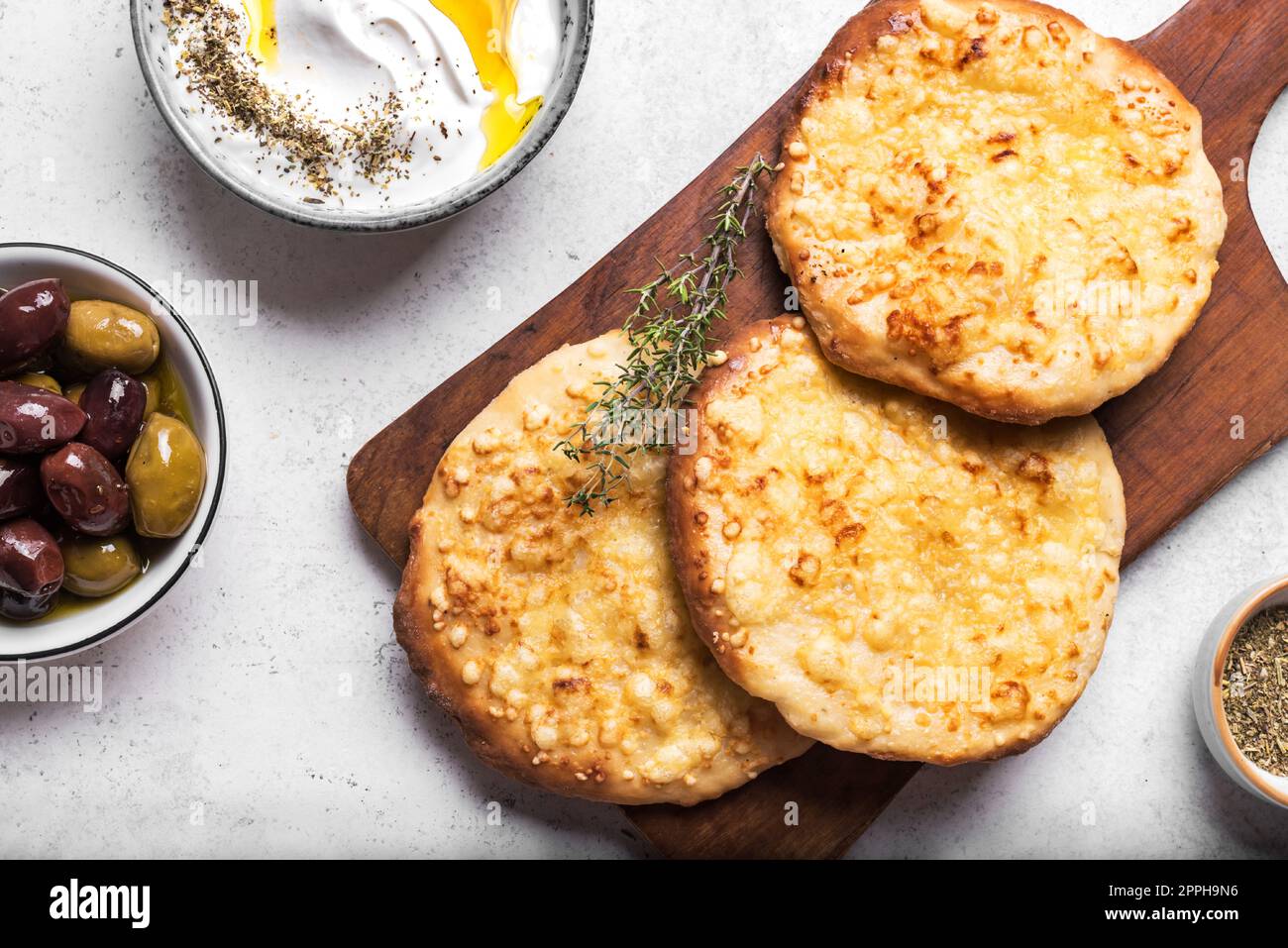 Manakeesh, arabic pizza, flat bread topped with cheese and zaatar ...