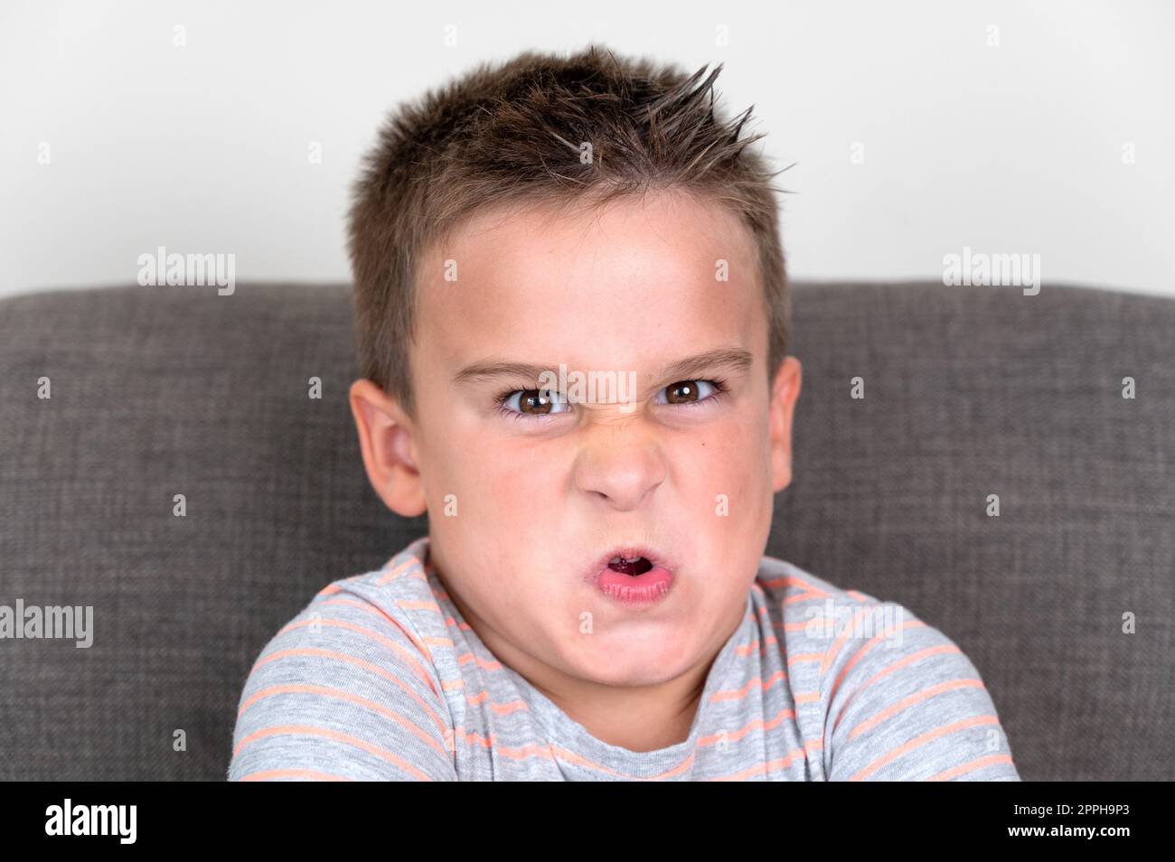 Portrait of a funny Male Child Making Faces Stock Photo - Alamy