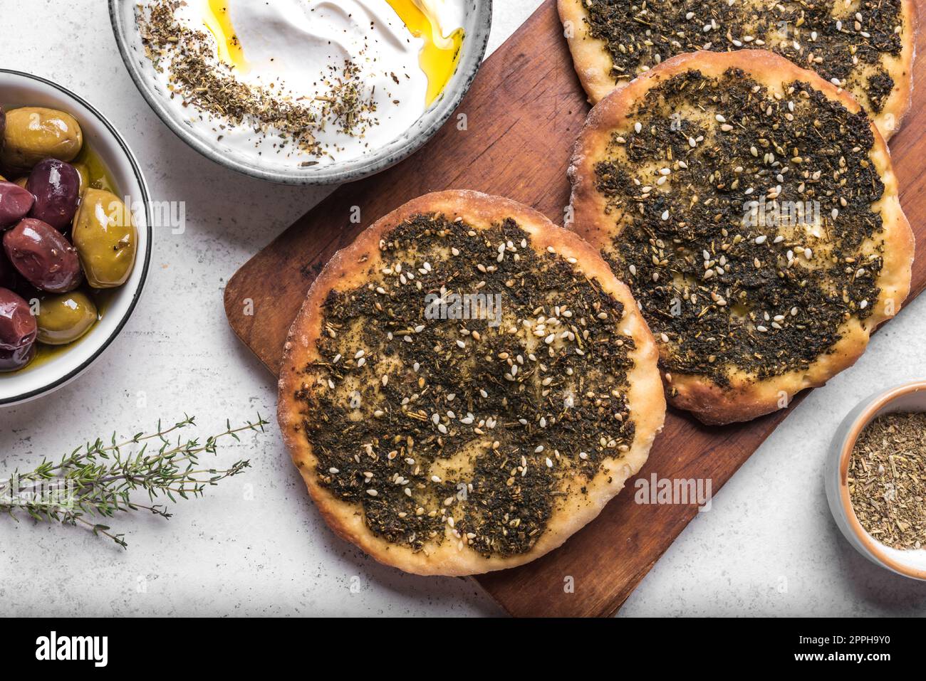 Manakeesh, arabic pizza, flat bread topped with zaatar spices close up ...