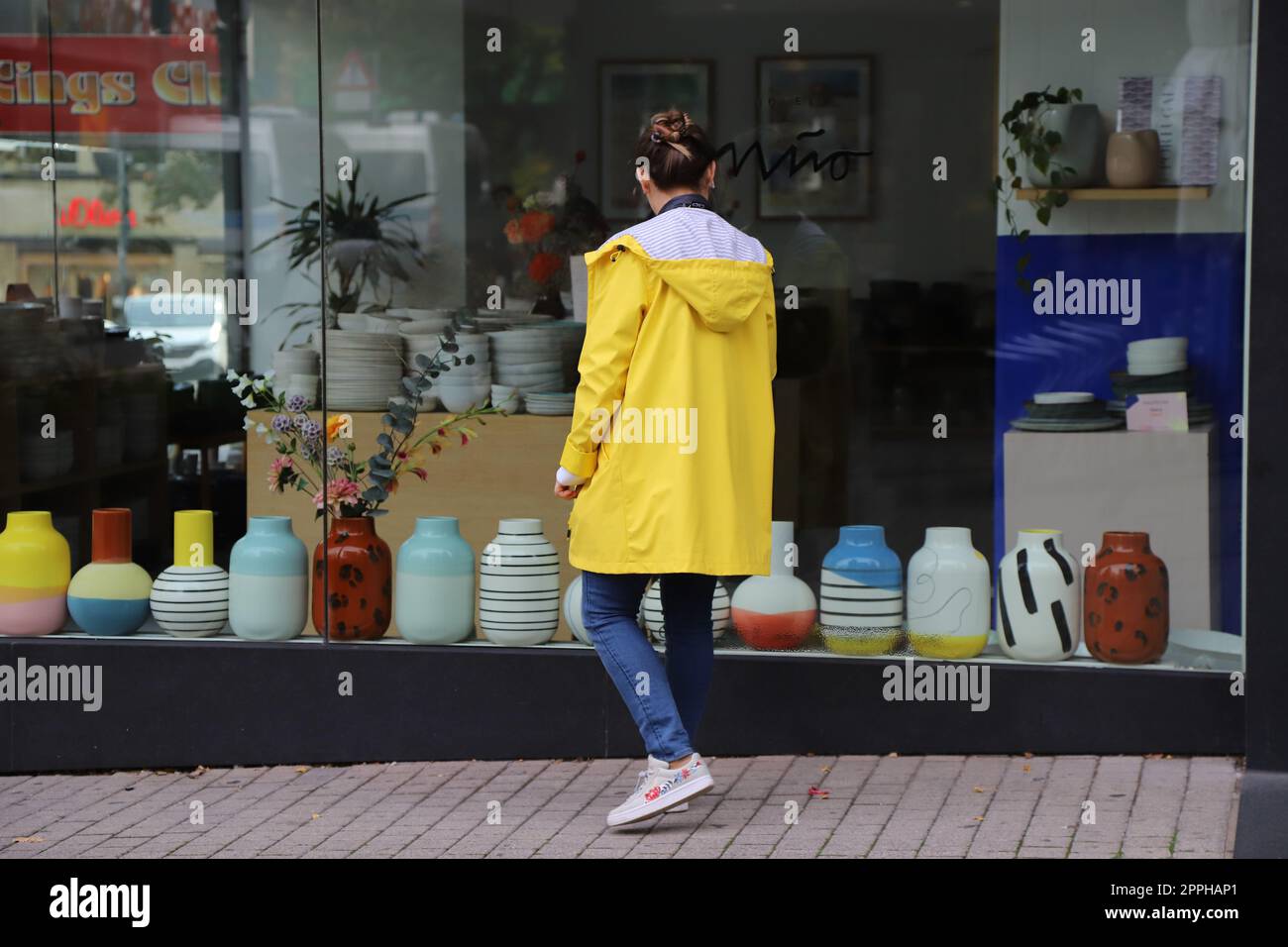 woman window shopping in the city on a shopping street Stock Photo - Alamy