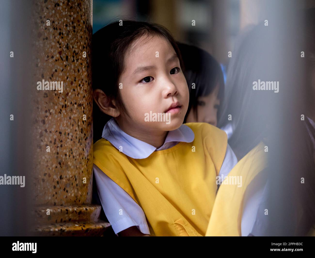 The little Asian girl feeling sad when she go to school Stock Photo - Alamy