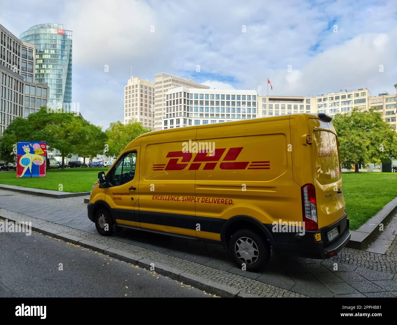 Berlin, Germany - 16. October 2022: A yellow van of the company DHL ...