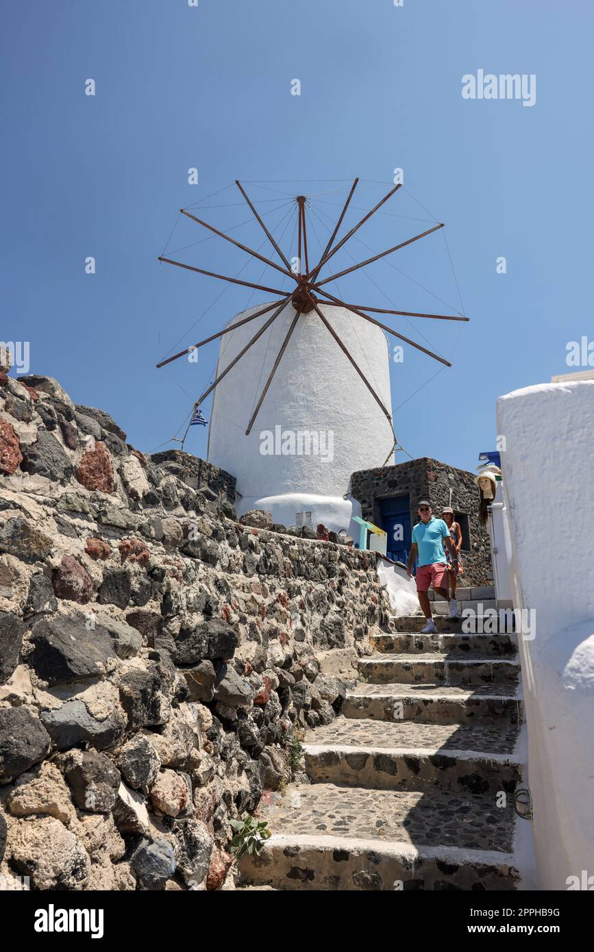 Traditional white windmill in Oia on Santorini Stock Photo - Alamy