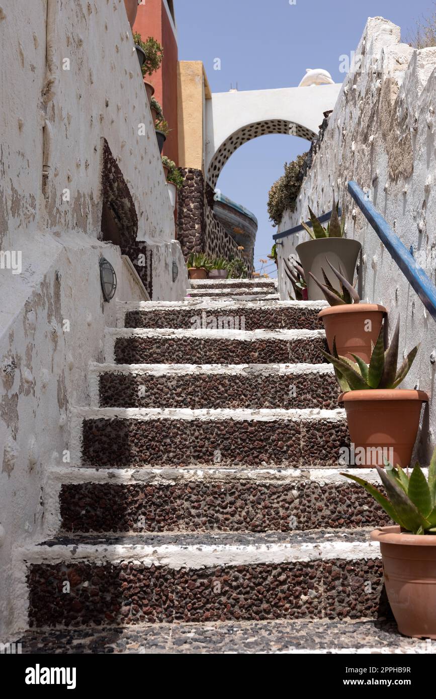 Narrow stone steps in Red beach on the south coast of Santorini island ...