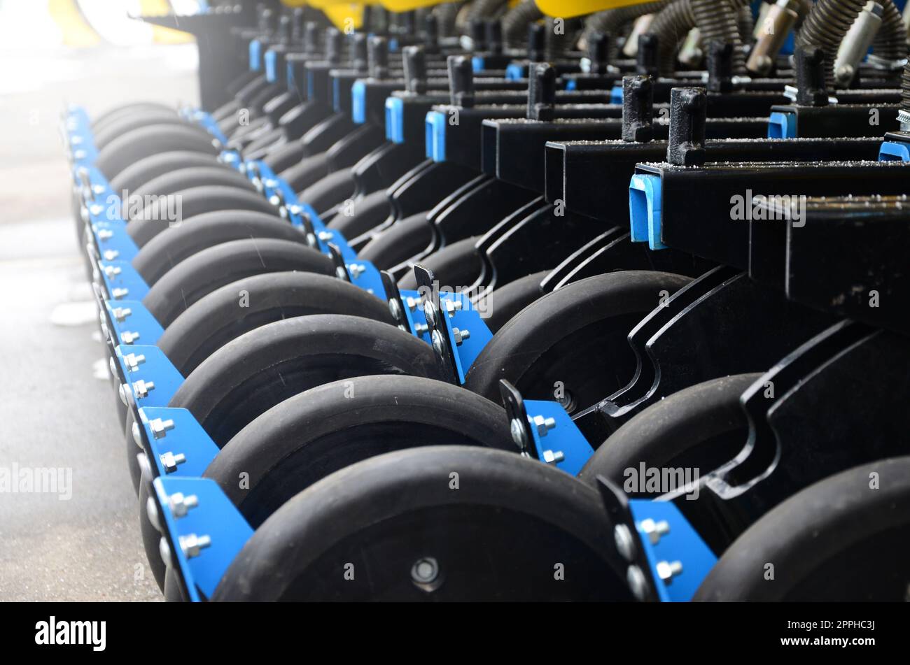 Row of wheels of the new industrial agricultural seeder close up Stock ...