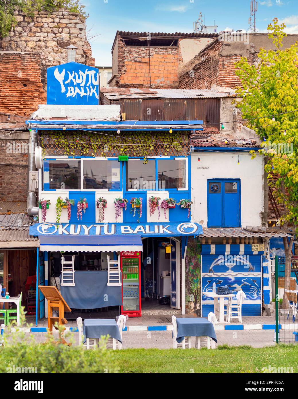 Traditional seafood restaurant painted in blue and white, located in ...