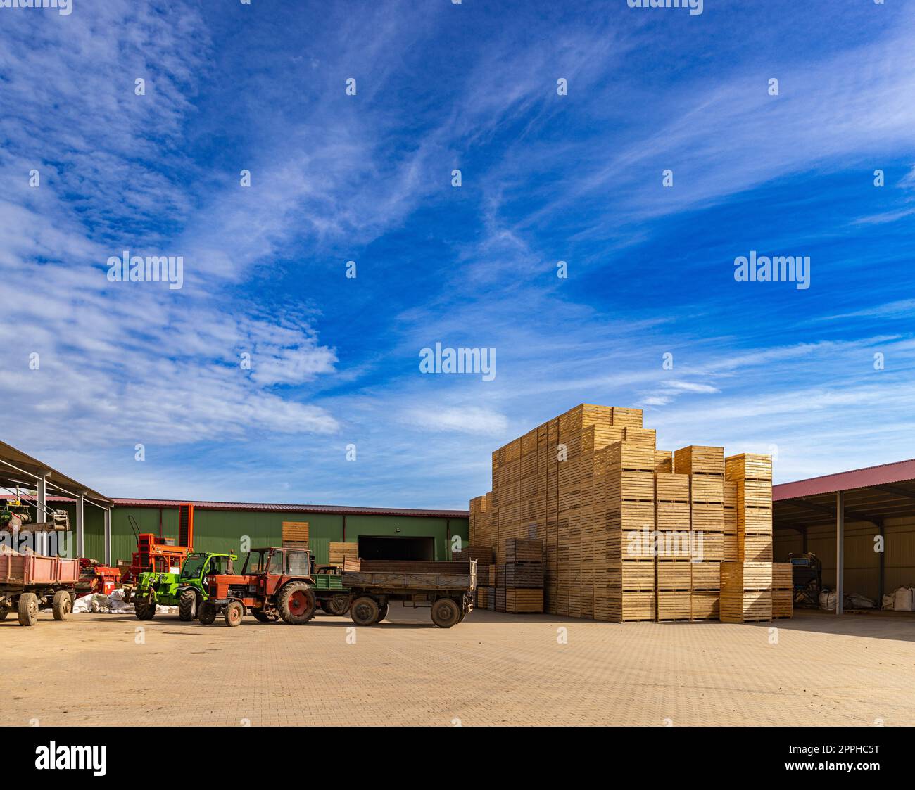 Boxes for potatoes storage in farm. Stacked wooden crates Stock Photo ...
