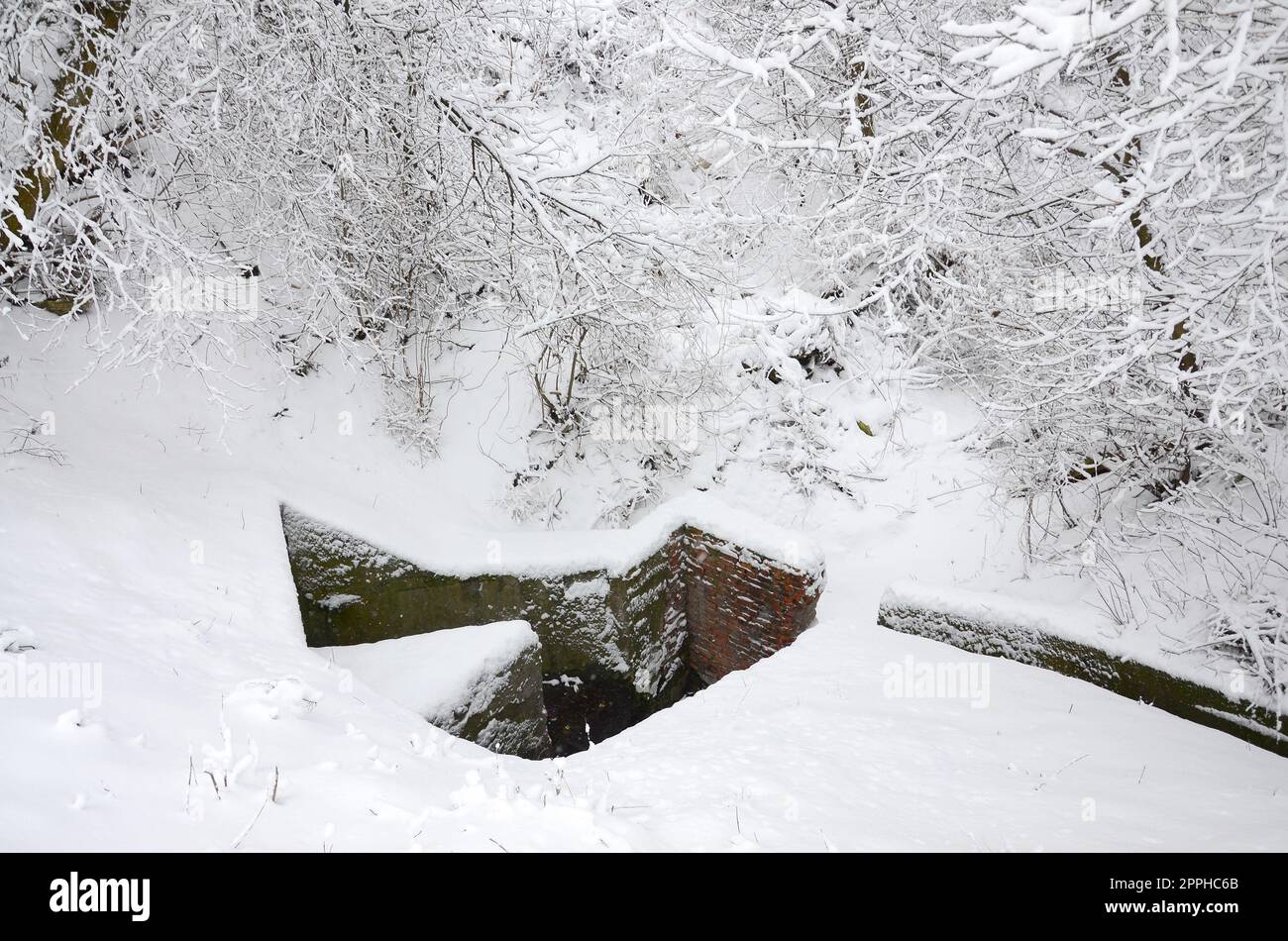 Underground bunker of old brick walls in winter after snowfall Stock ...