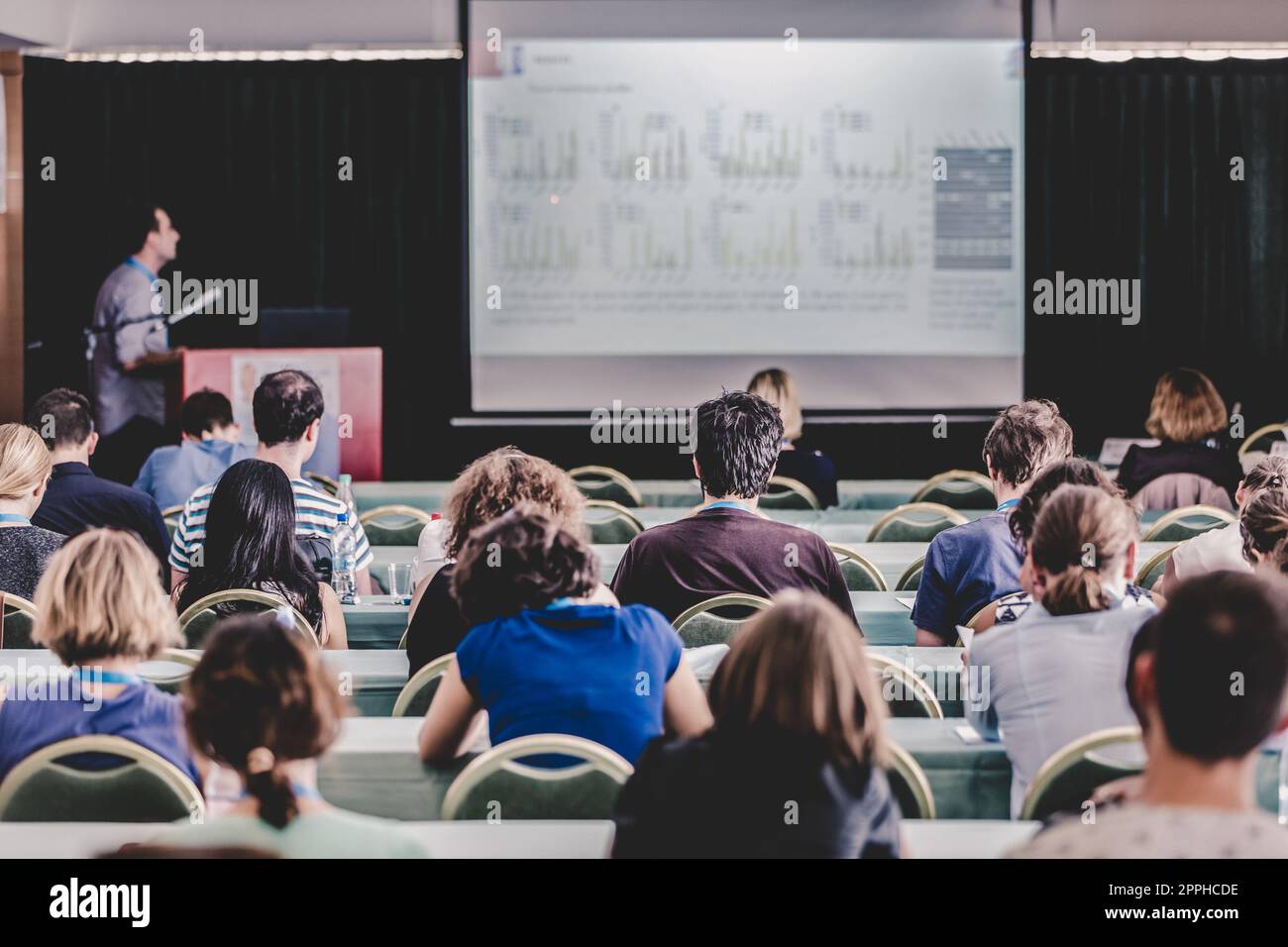 Audience in lecture hall participating at scientific conference Stock ...