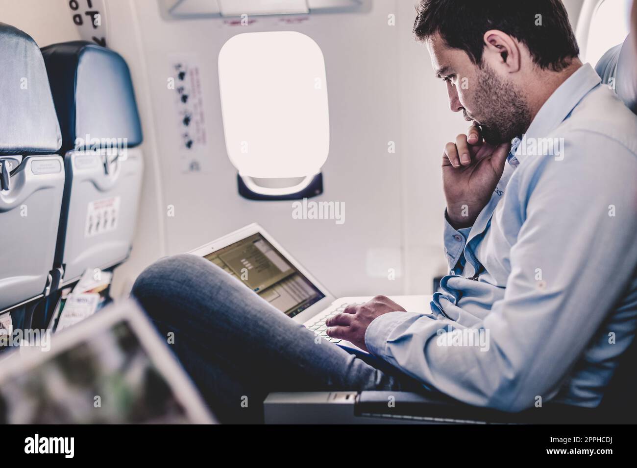 Laptop passenger seat plane hi-res stock photography and images - Alamy