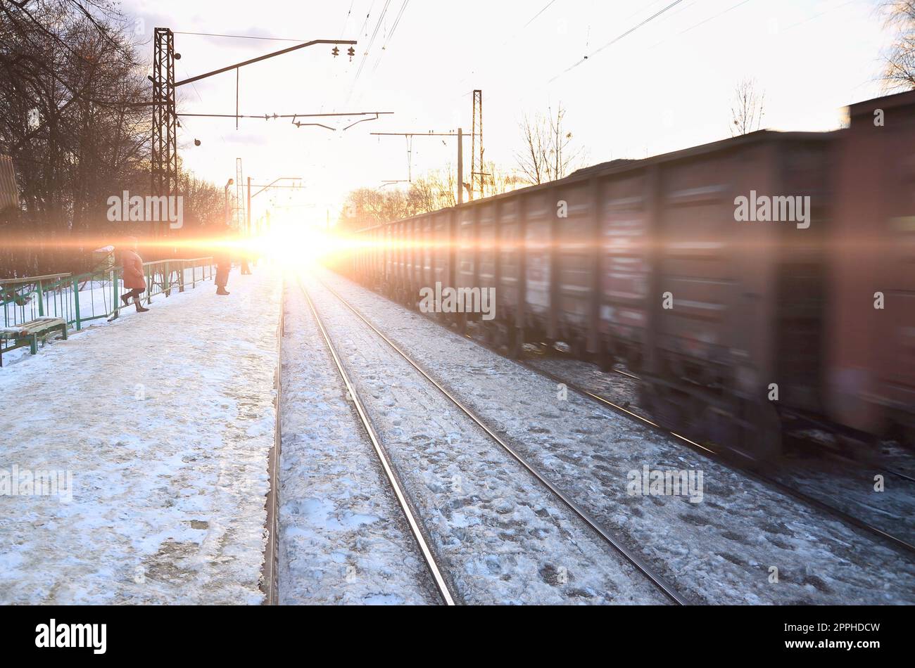 Evening winter landscape with the railway station Stock Photo - Alamy