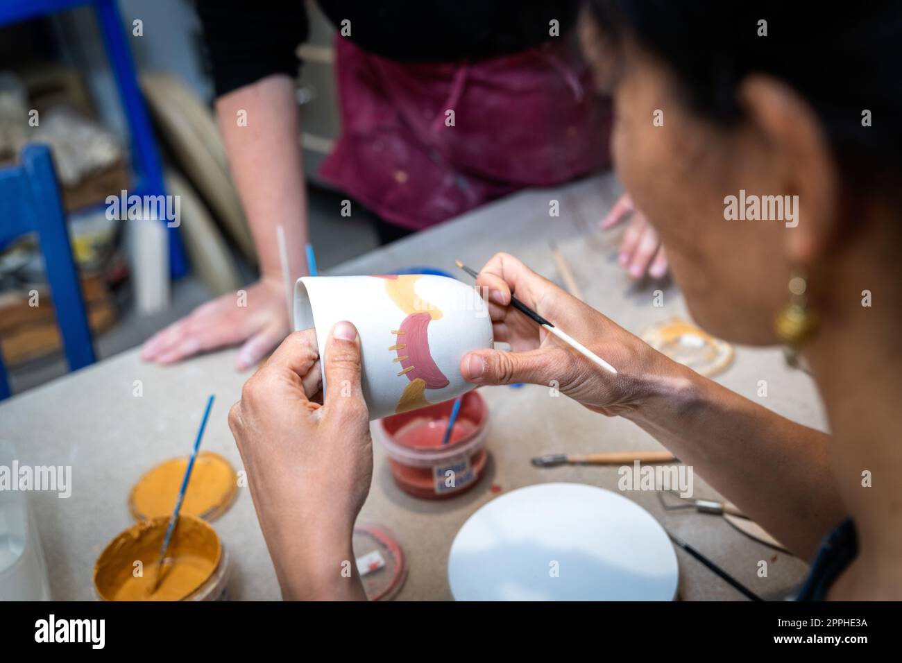Woman clay painting workshop hi-res stock photography and images - Alamy