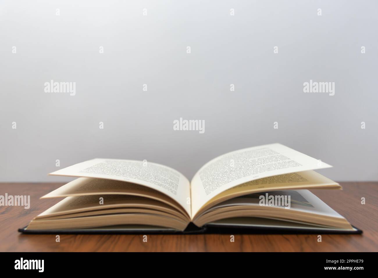 open book on desk education learning copy space Stock Photo - Alamy