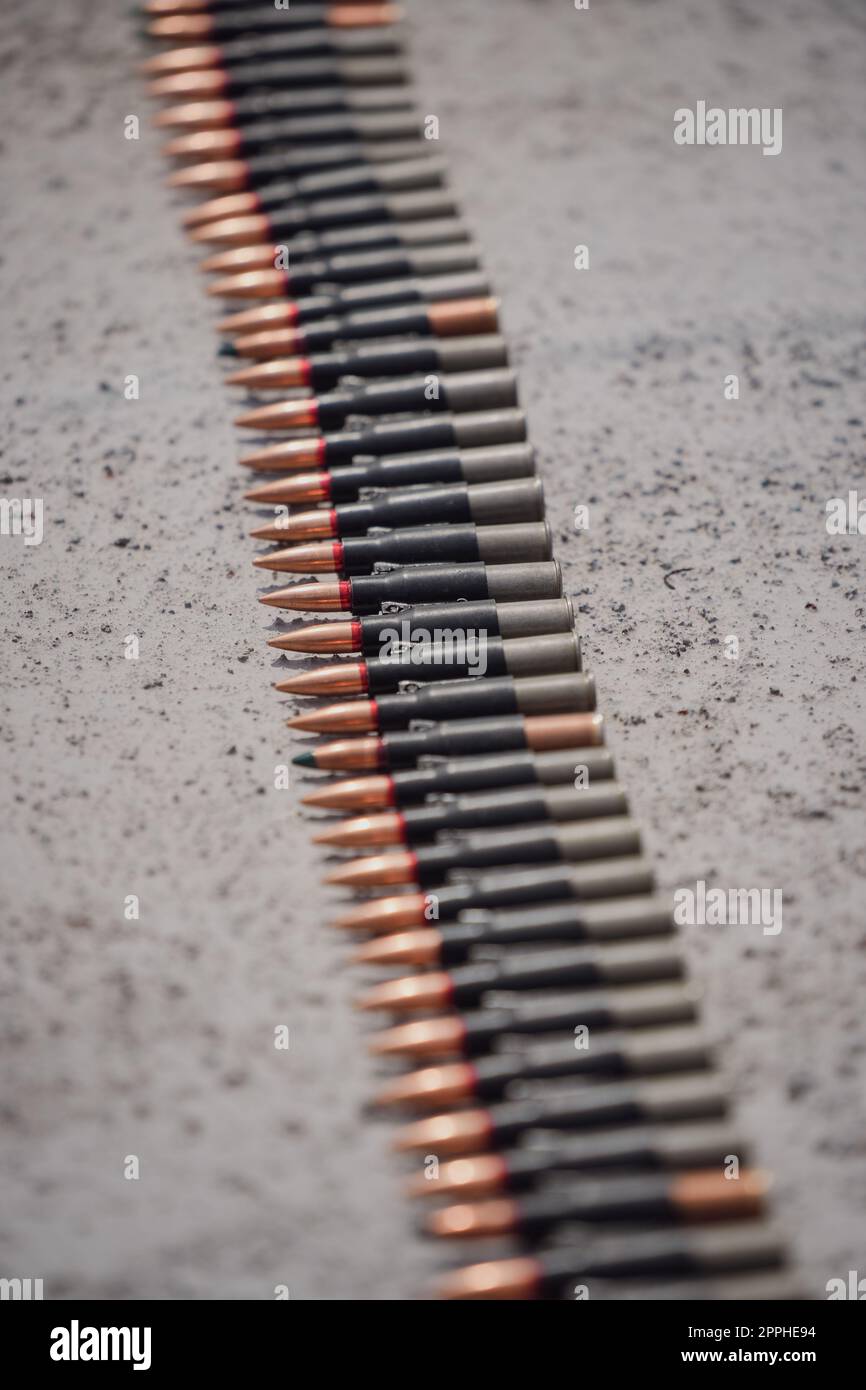 Machine gun belt loaded with cartridges Stock Photo - Alamy