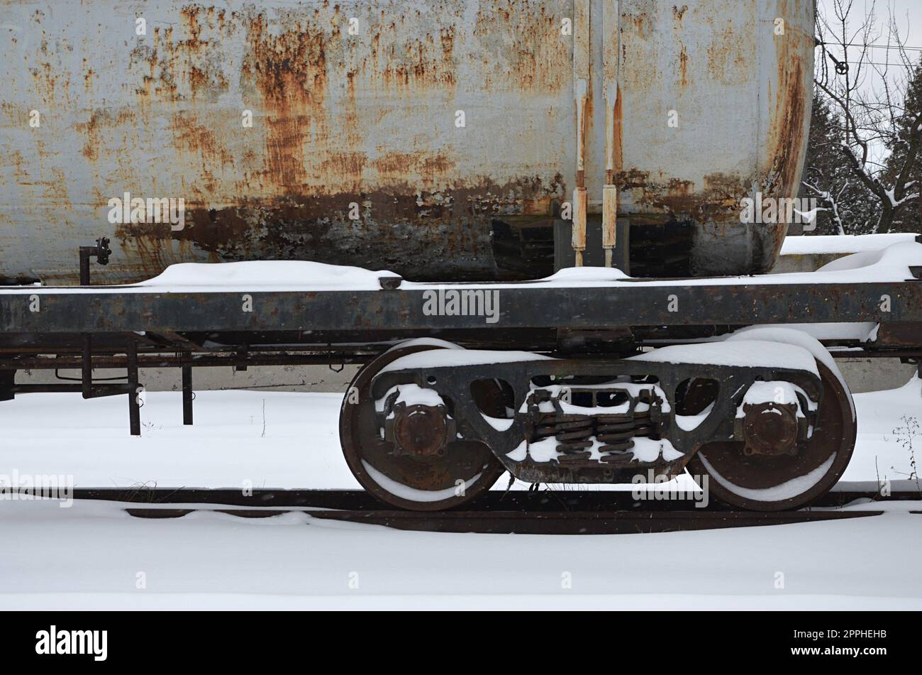Parts of the snowy freight railcar Stock Photo - Alamy
