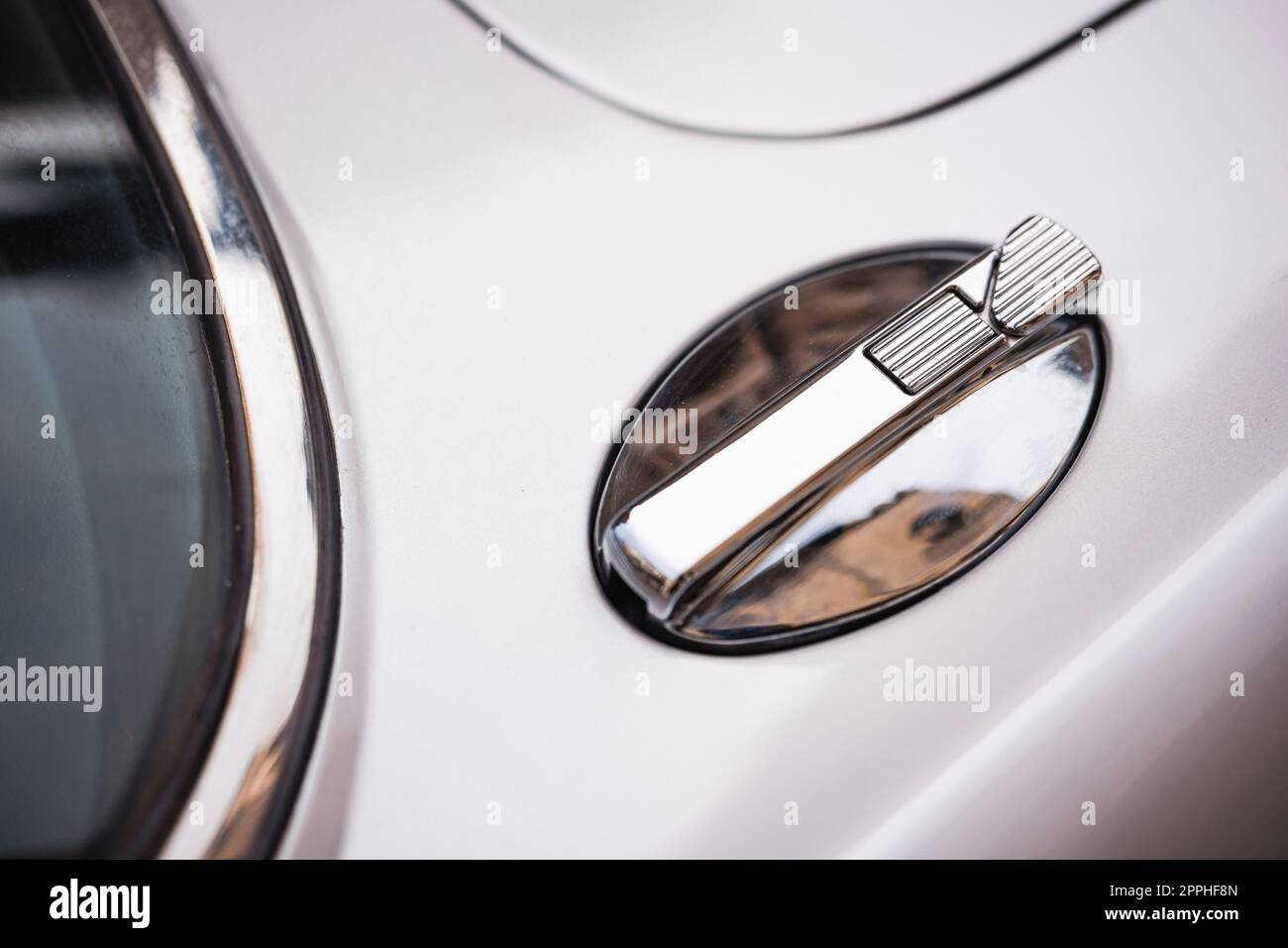 Vintage car fuel tank cap with key slot Stock Photo - Alamy