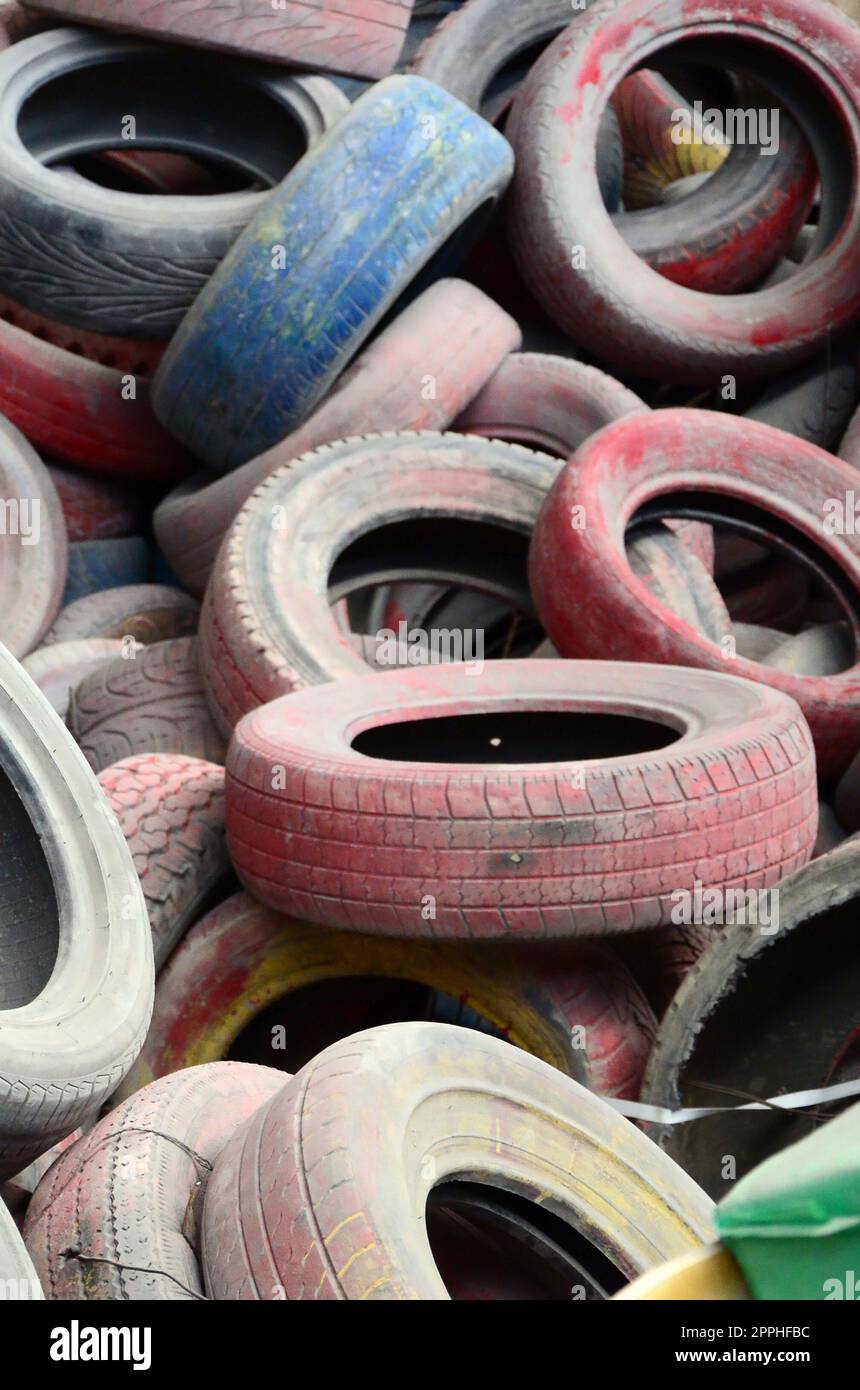 A picture of many old used tires left on a waste dump Stock Photo - Alamy