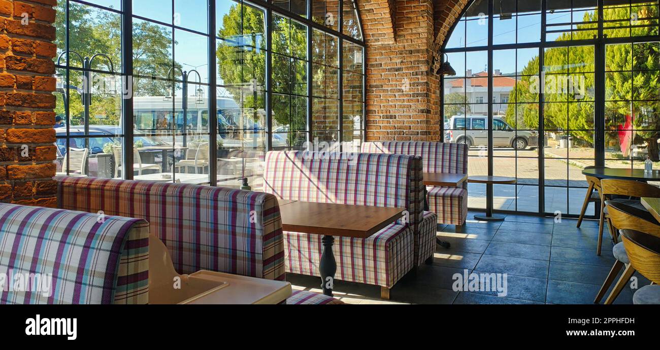 Bar interior with counter, stools and square tables. An empty cafeteria ...