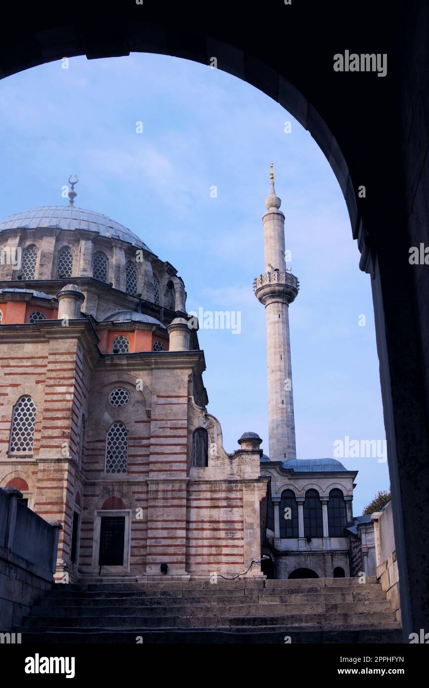 Old mosque in Istanbul, Turkey. Exterior view of the main dome and minarets, taken from the ...