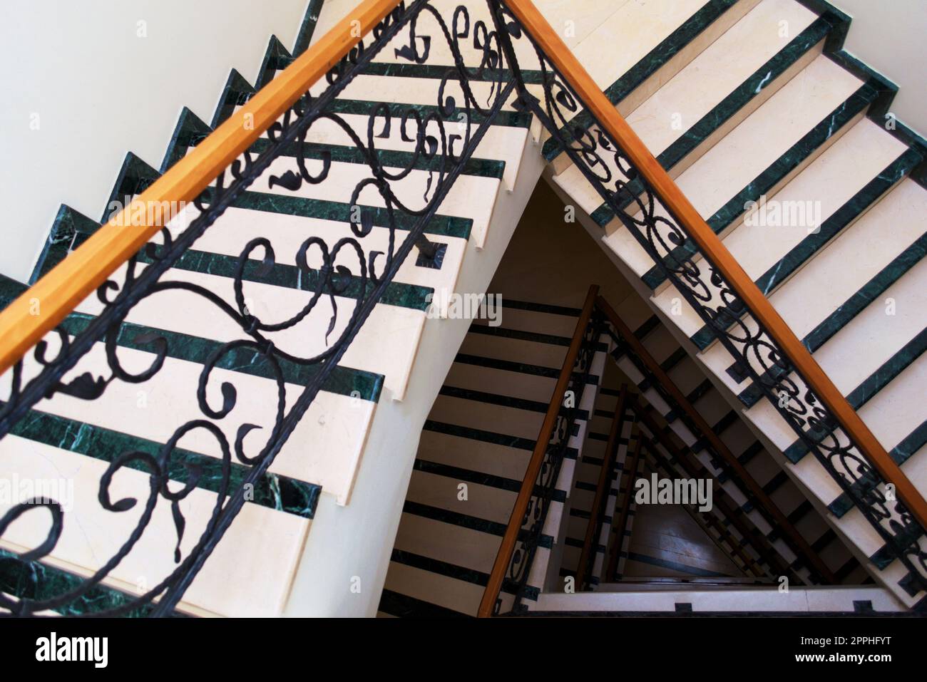 Triangle spiral shapes on the stairwell of a building. Architectural ...