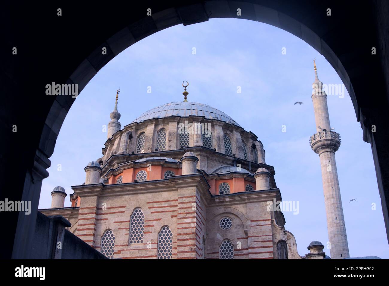 Old mosque in Istanbul, Turkey. Exterior view of the main dome and minarets, taken from the ...