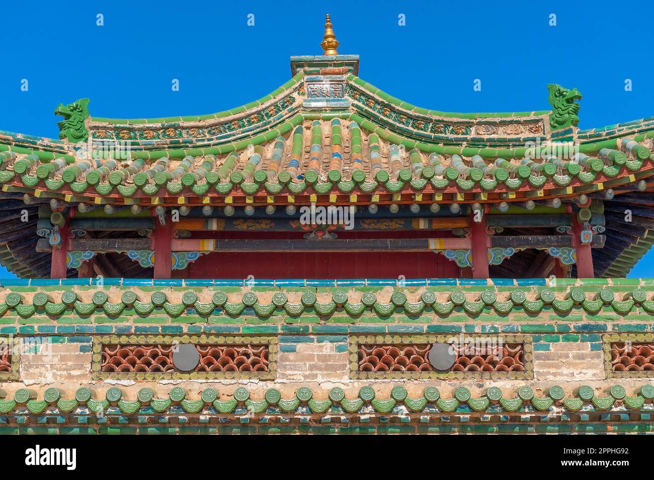 Curved roof structure with enameled, colorful roof tiles of a monastery ...